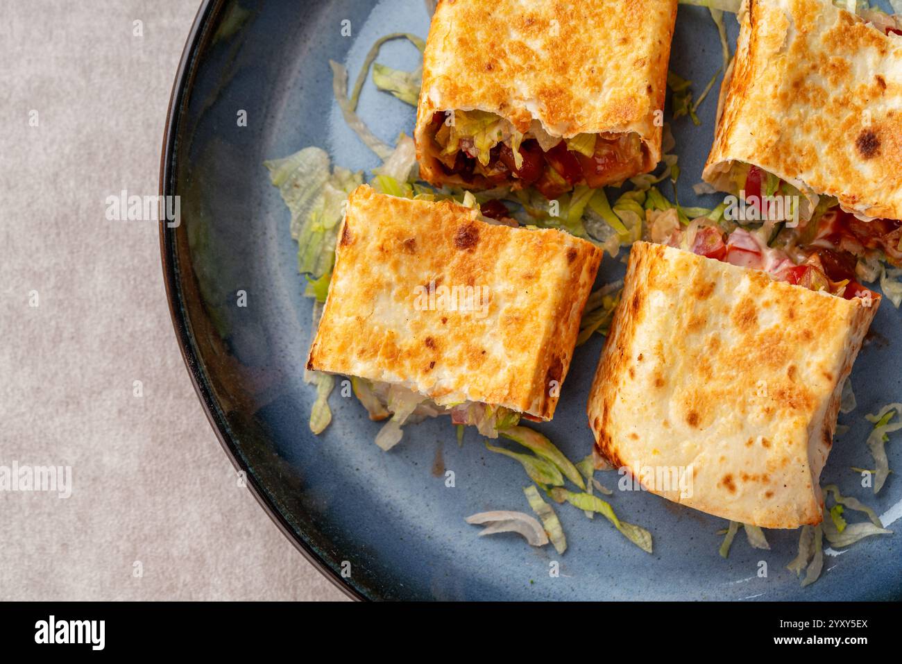 chicken shawarma sandwich fresh roll, wrap of grilled meat and salad ...