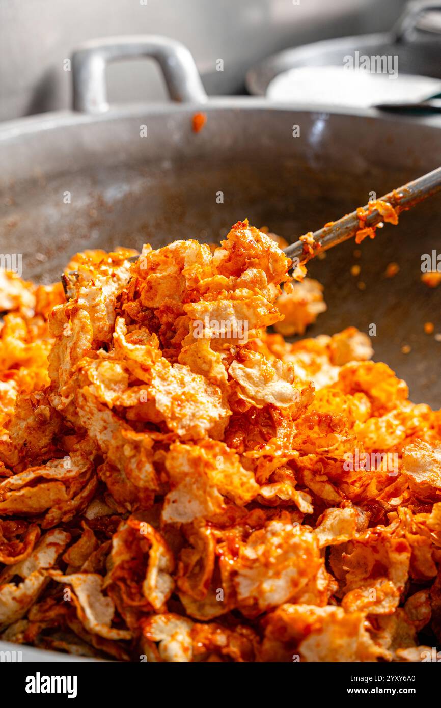 making process Emping Balado, Spicy Snacks from West Sumatra. Made from ...