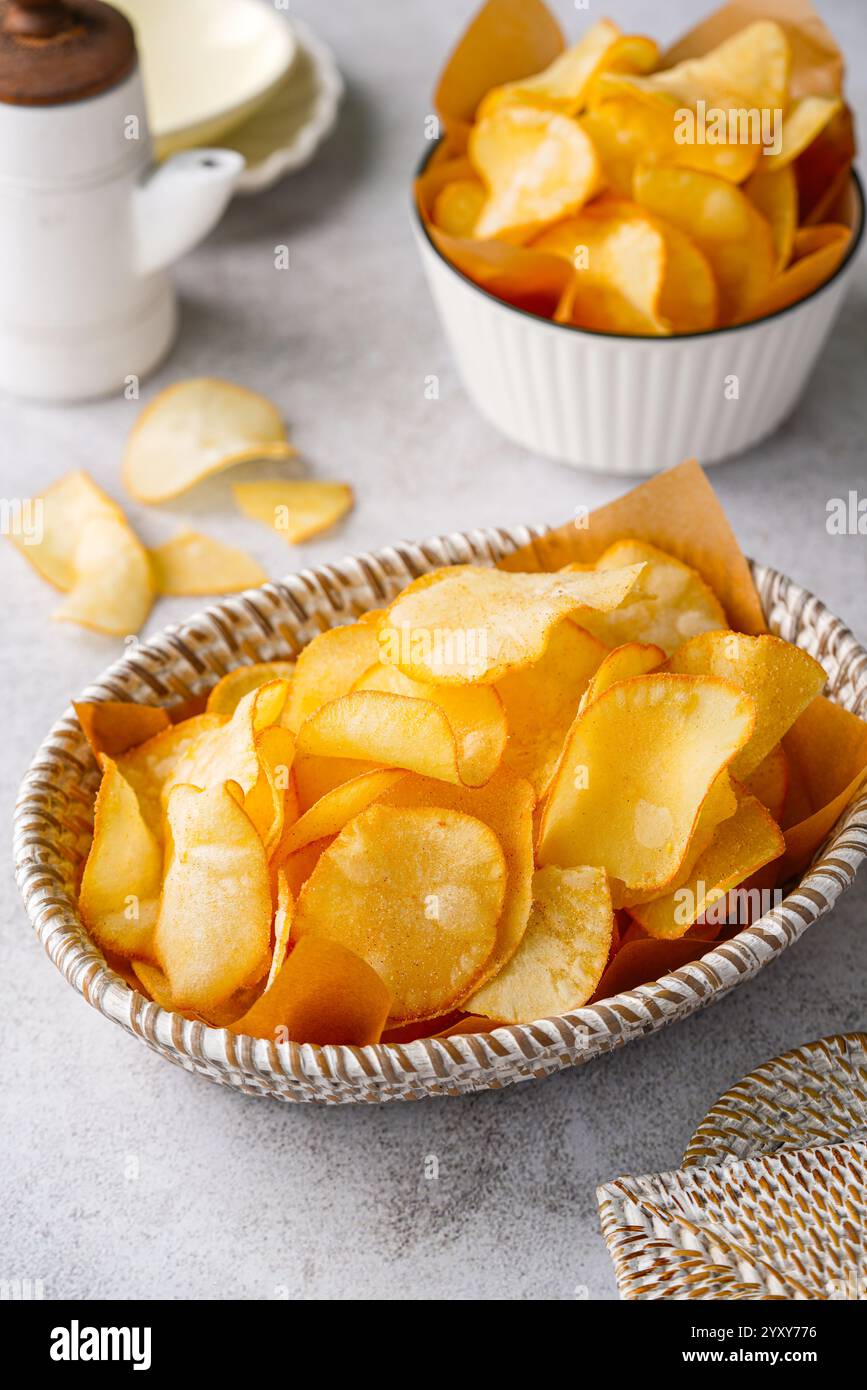 Cassava chips, a traditional Indonesian snack, are made from thin ...