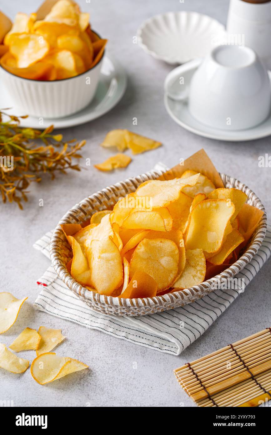 Cassava chips, a traditional Indonesian snack, are made from thin ...