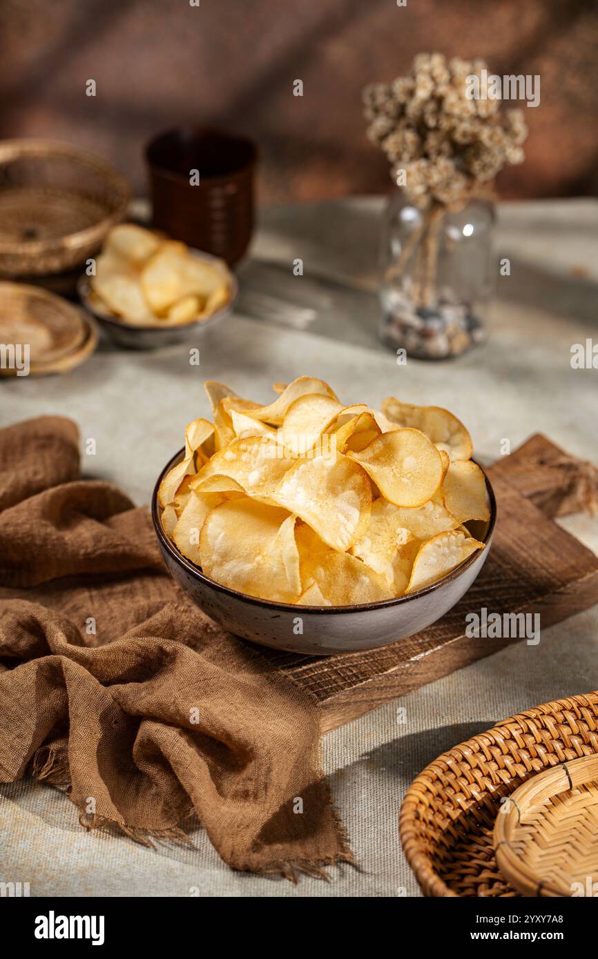 Cassava chips, a traditional Indonesian snack, are made from thin ...