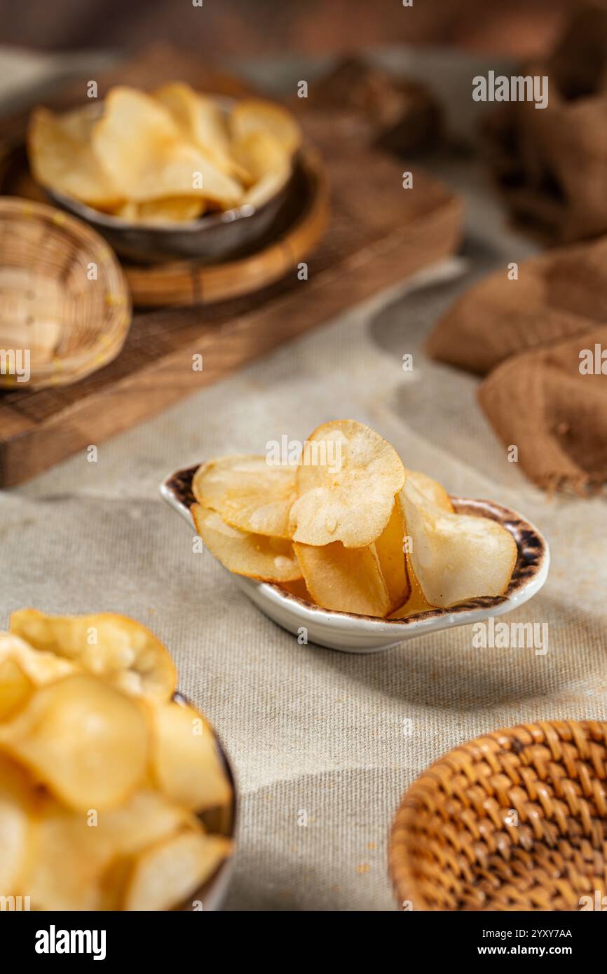 Cassava chips, a traditional Indonesian snack, are made from thin ...