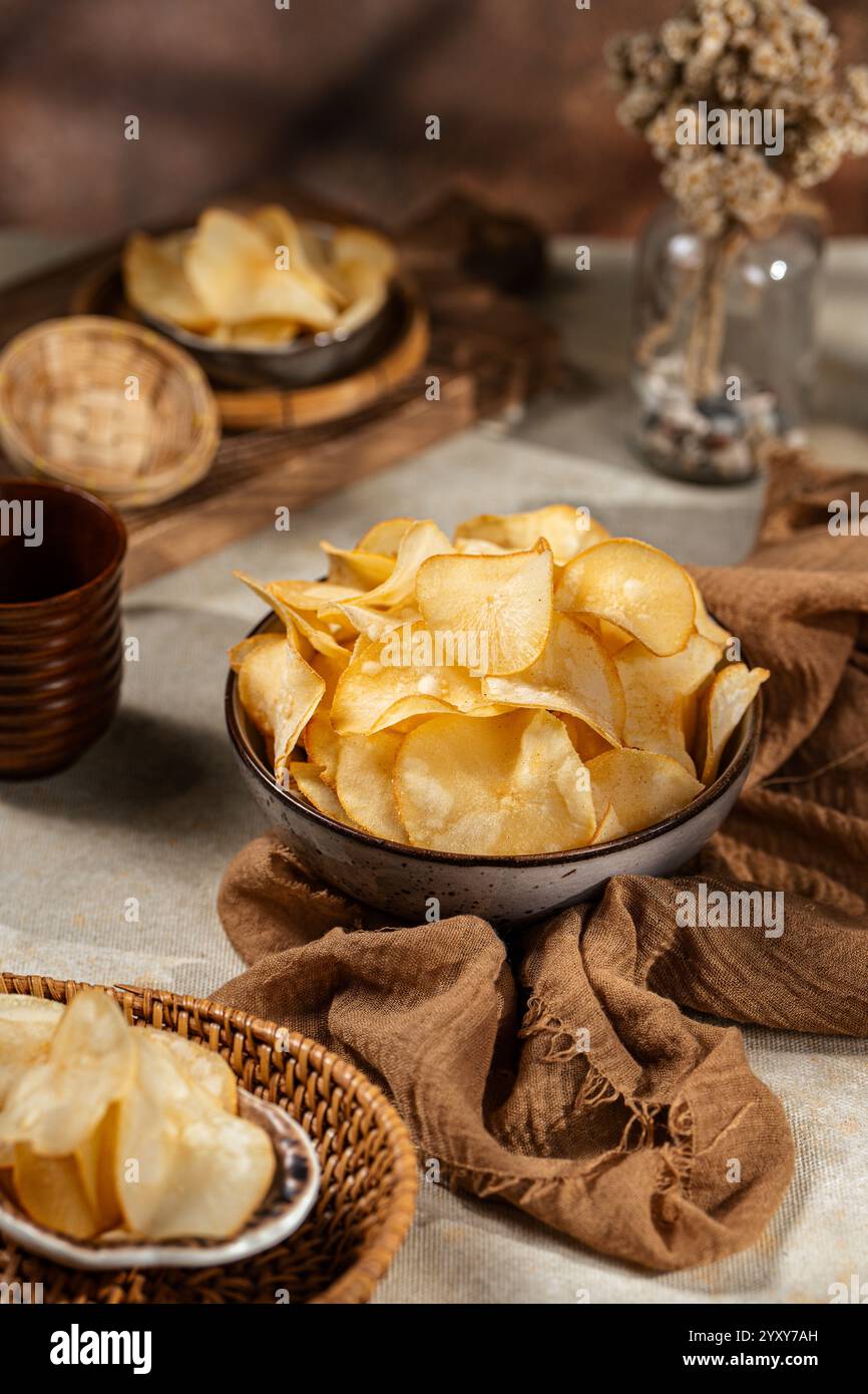 Cassava chips, a traditional Indonesian snack, are made from thin ...