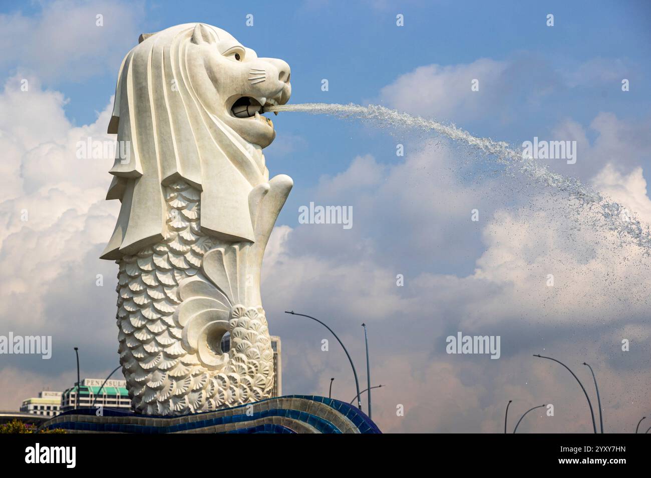 Merlion statue at Merlion Park in Singapore spouting water against a ...