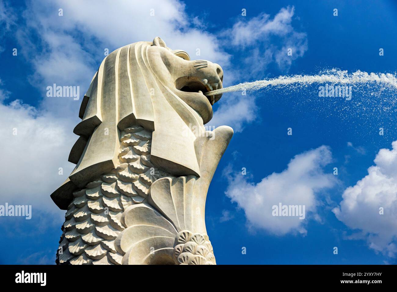 Merlion statue at Merlion Park in Singapore spouting water against a ...