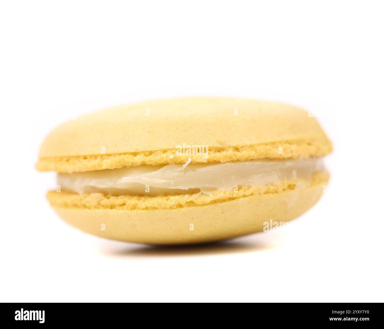 Yellow macaron cakes. Isolated. Close up. White background Stock Photo ...