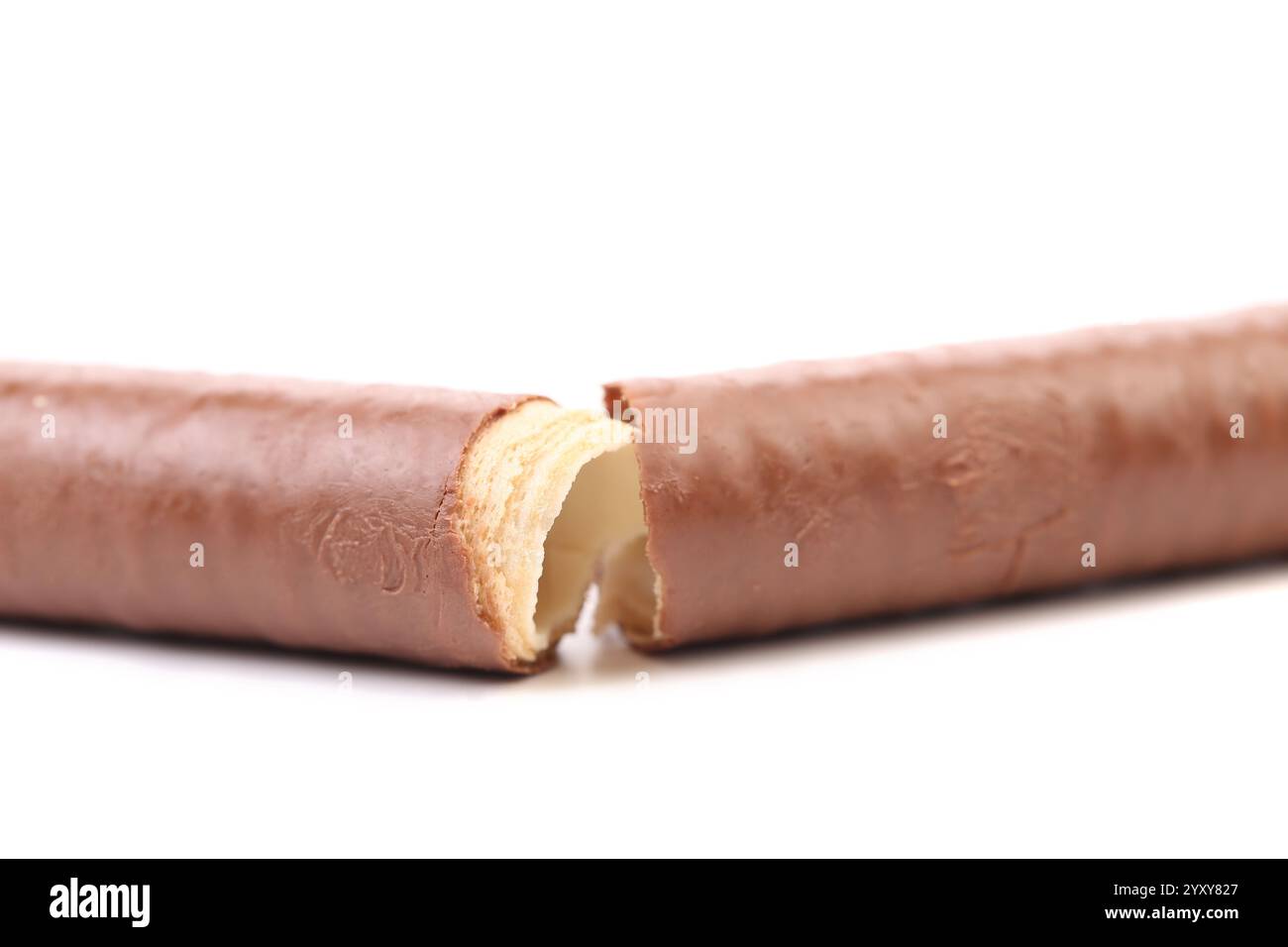 Broken waffle roll coated chocolate. White background Stock Photo - Alamy