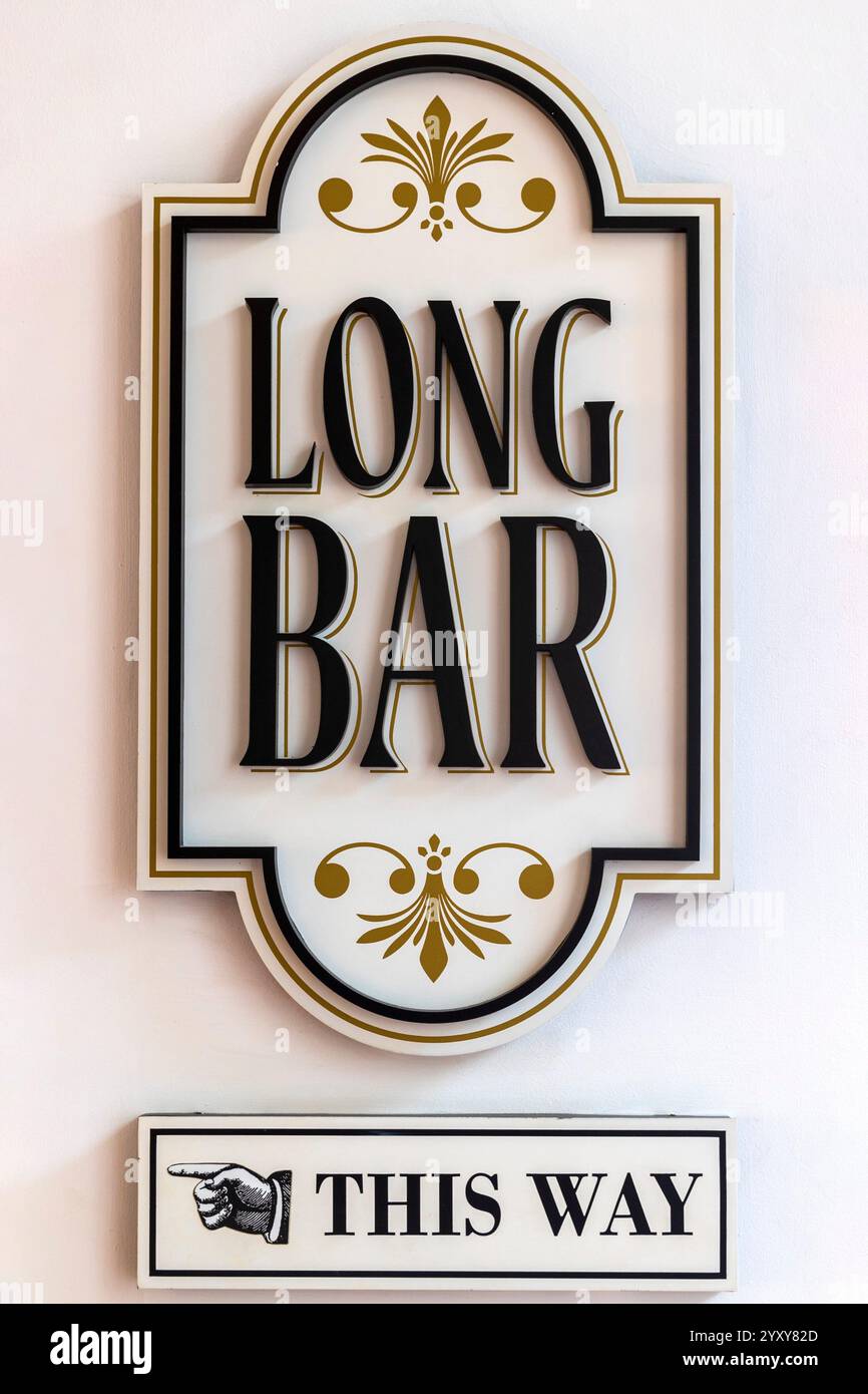 Direction sign to the Long Bar at Raffles Hotel, Singapore home of the ...