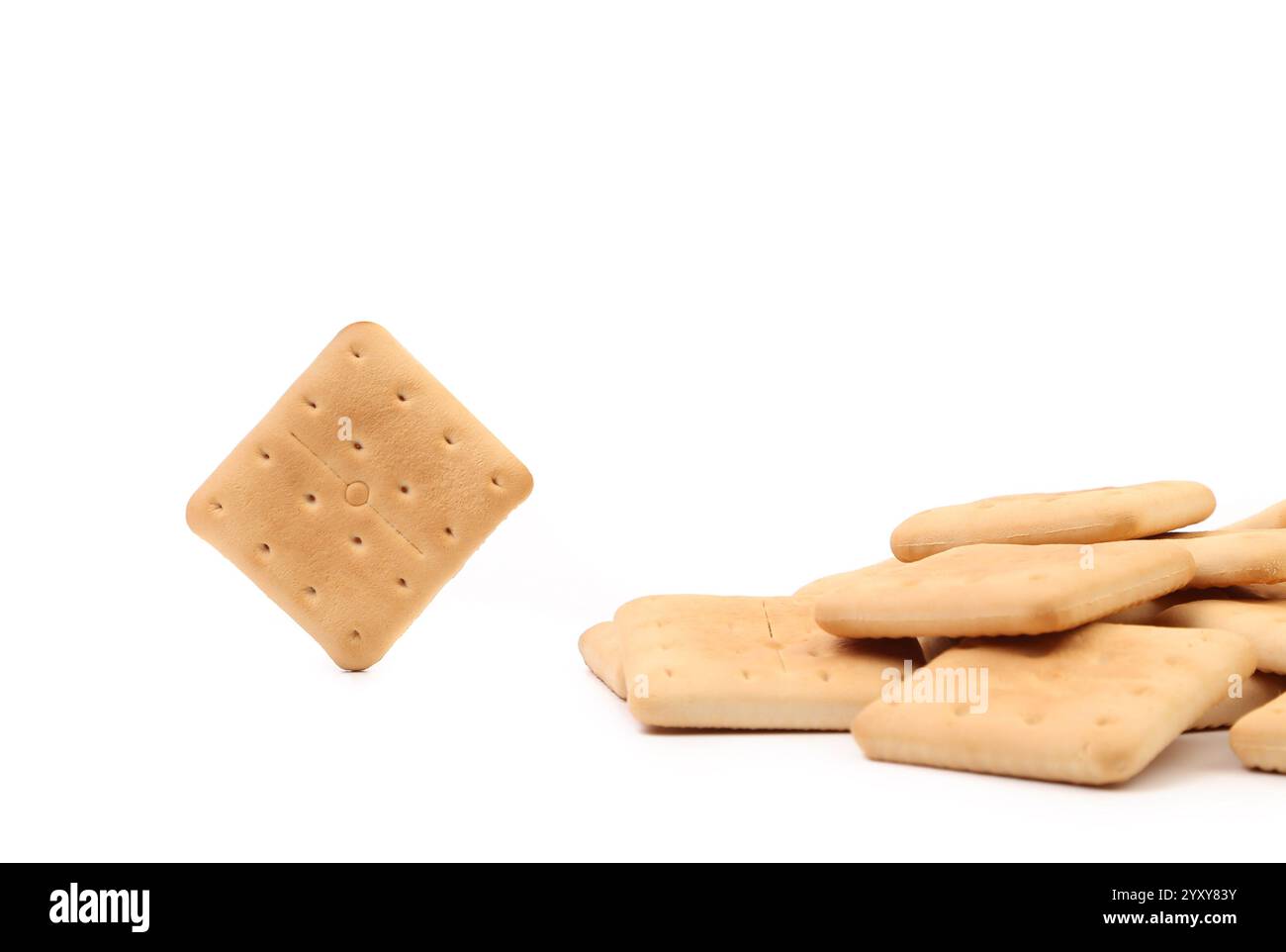 One saltine soda cracker and several. White background Stock Photo - Alamy