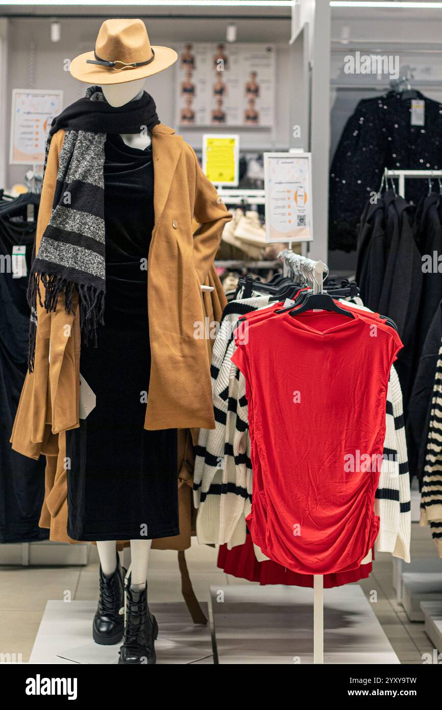 stylish mannequin in a hat and coat in the women's department Stock ...