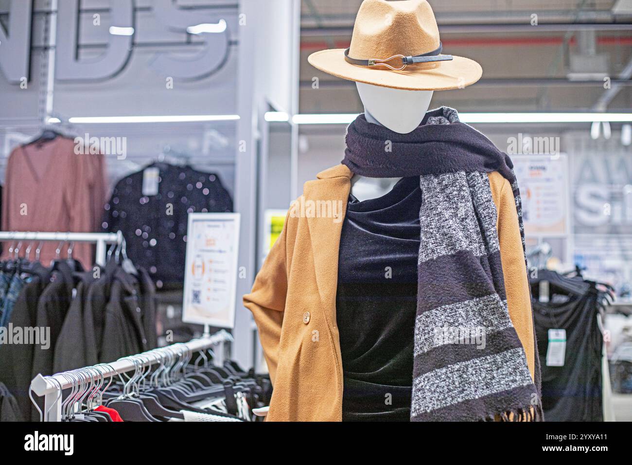 stylish mannequin in a hat and coat in the women's department Stock ...