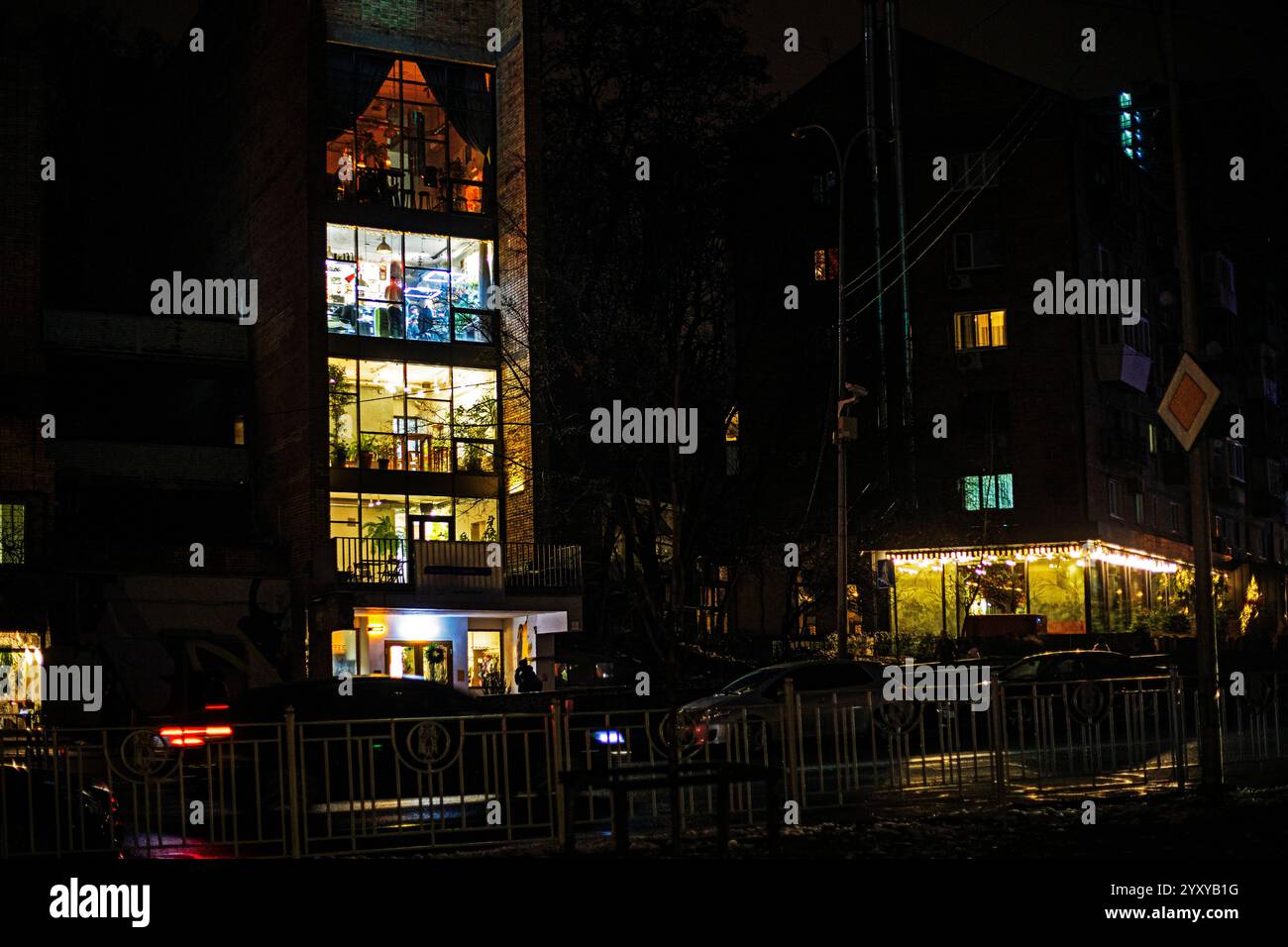 beautiful night city with lights on in windows Stock Photo - Alamy