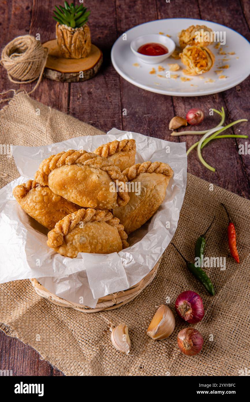 Curry puff or Pastel goreng. it is a small pie consisting of curry with ...