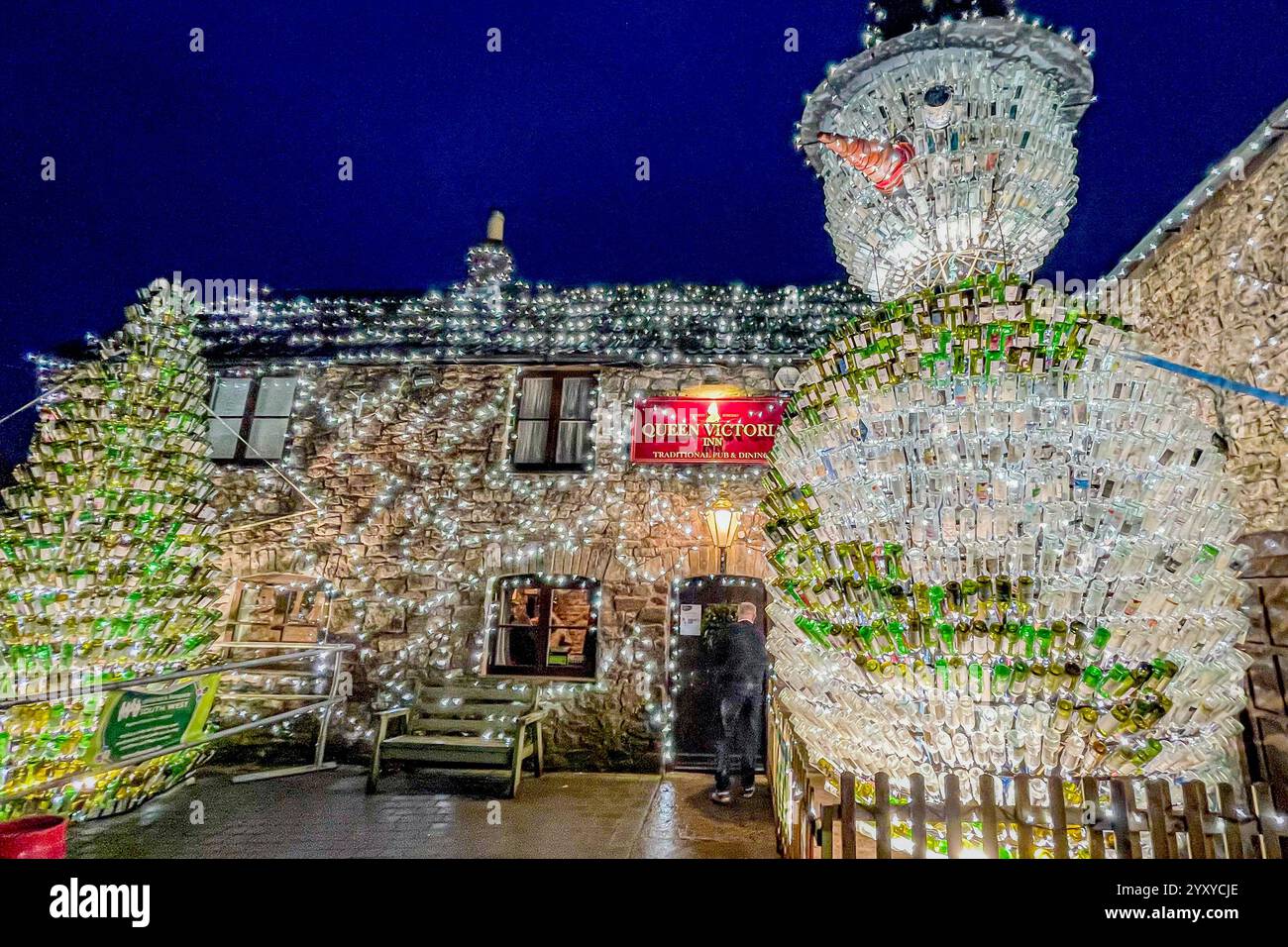 Christmas decorations, including a tree and snowman made from empty ...