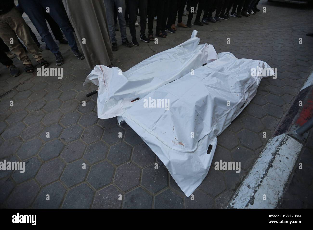 Relatives of the Palestinians died in Israeli attacks, mourn as they ...