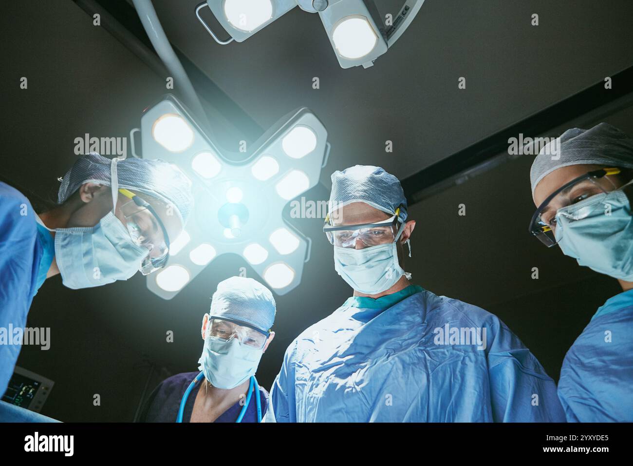Hospital, surgery and low angle of team of doctors in operation for ...