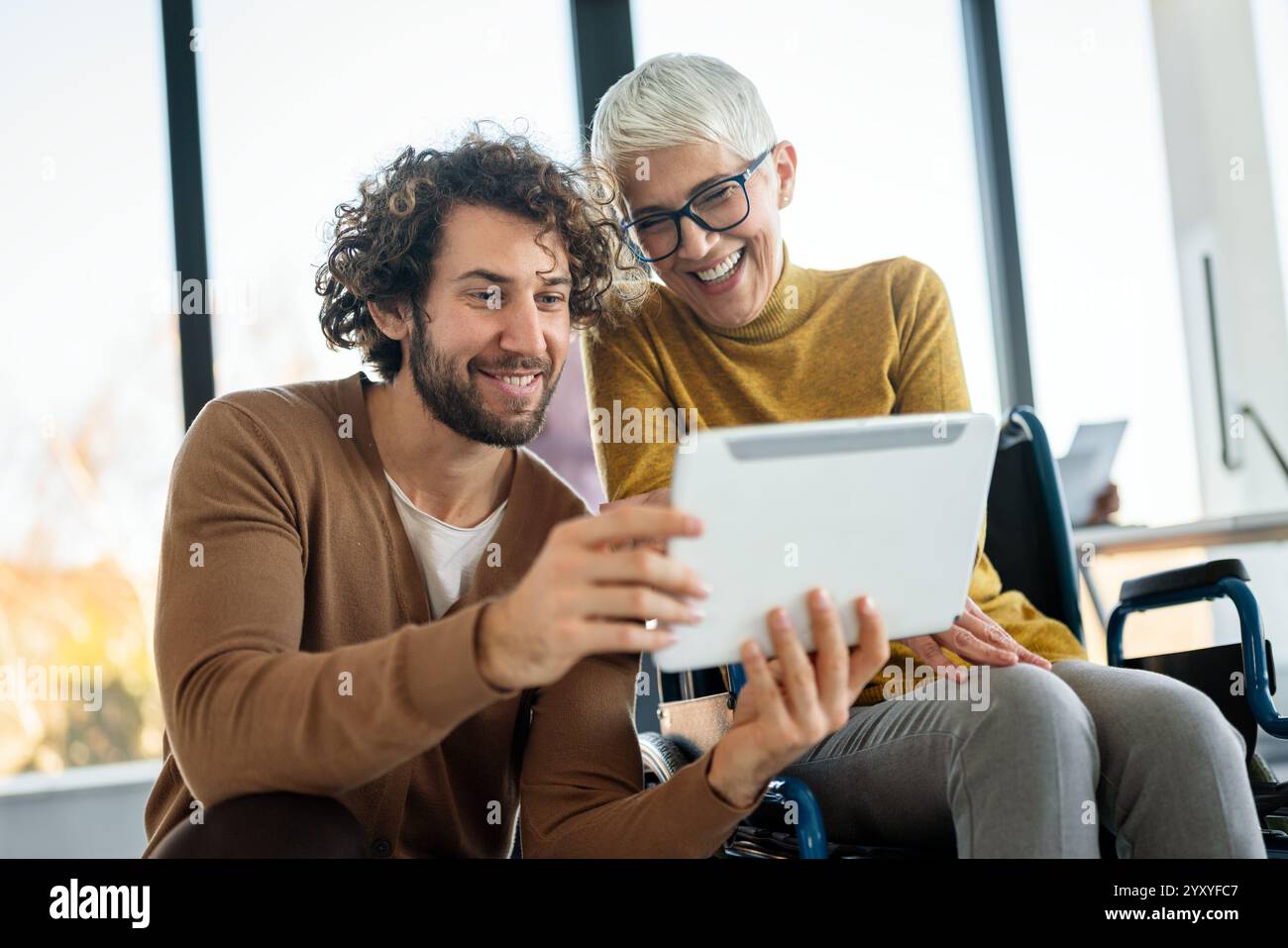 The image includes a person using a wheelchair, depicting inclusivity ...