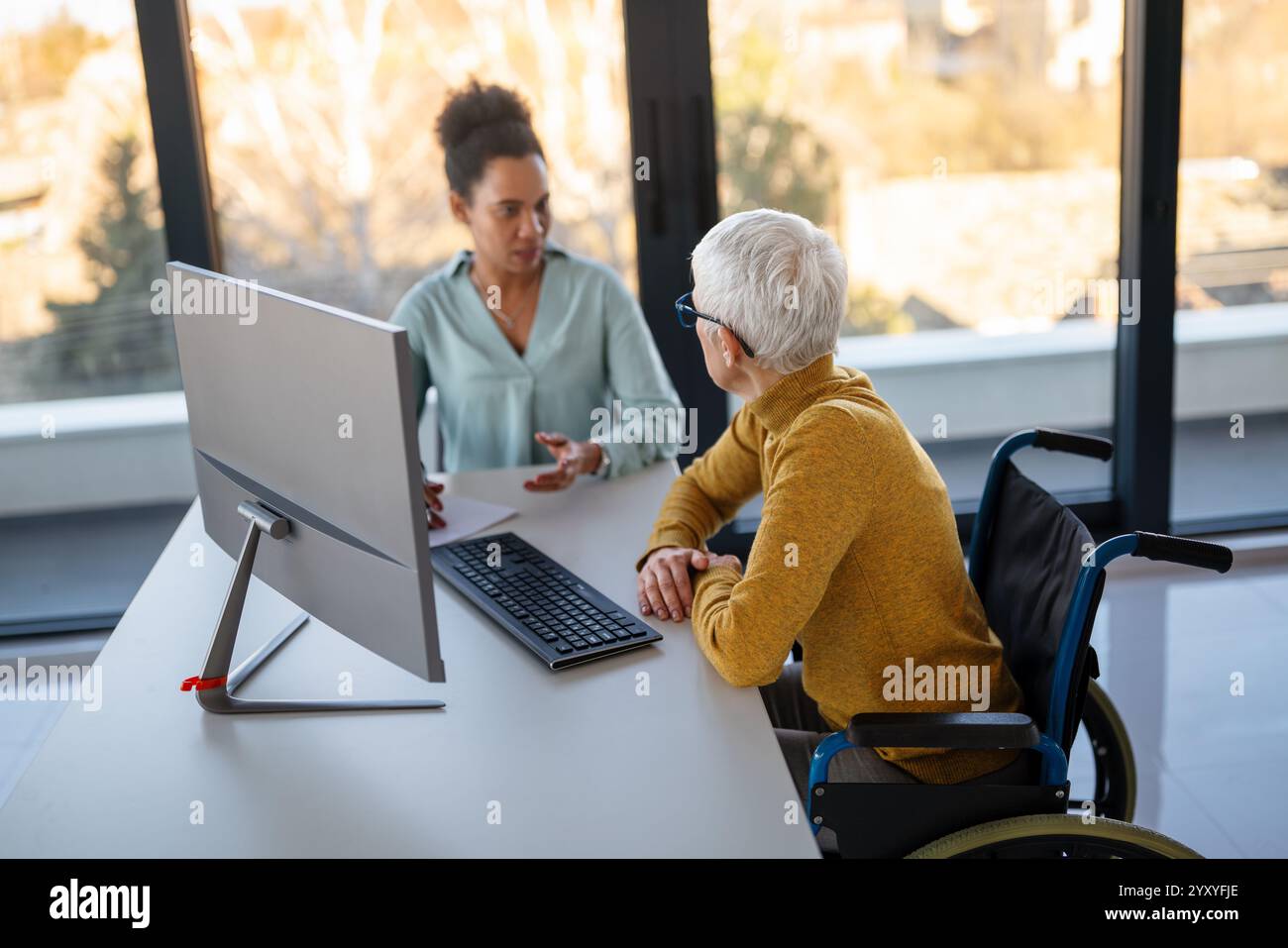 The image includes a person using a wheelchair, depicting inclusivity ...