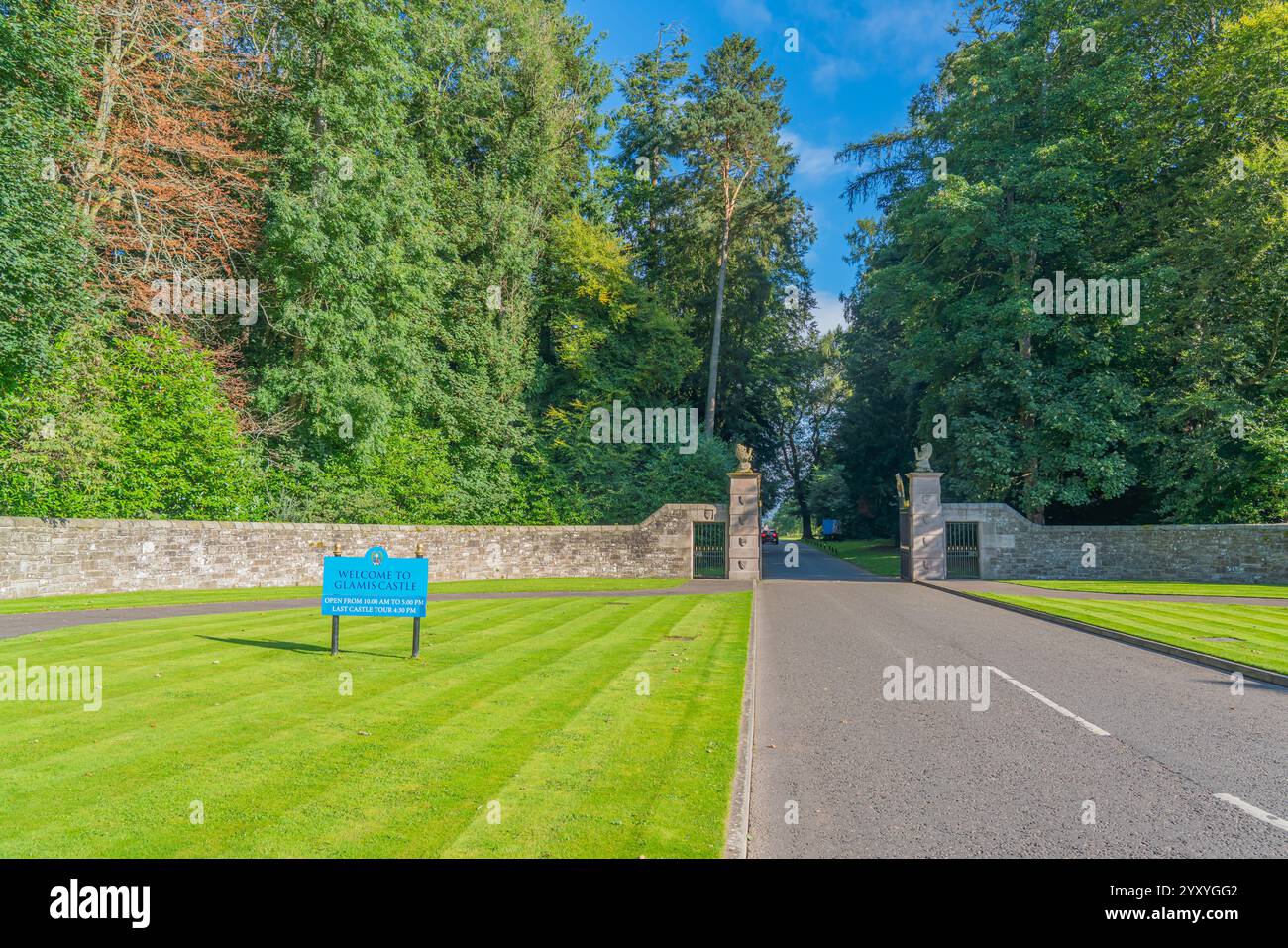 Entrance gate to the historical Glamis Castle in Scotland with green ...