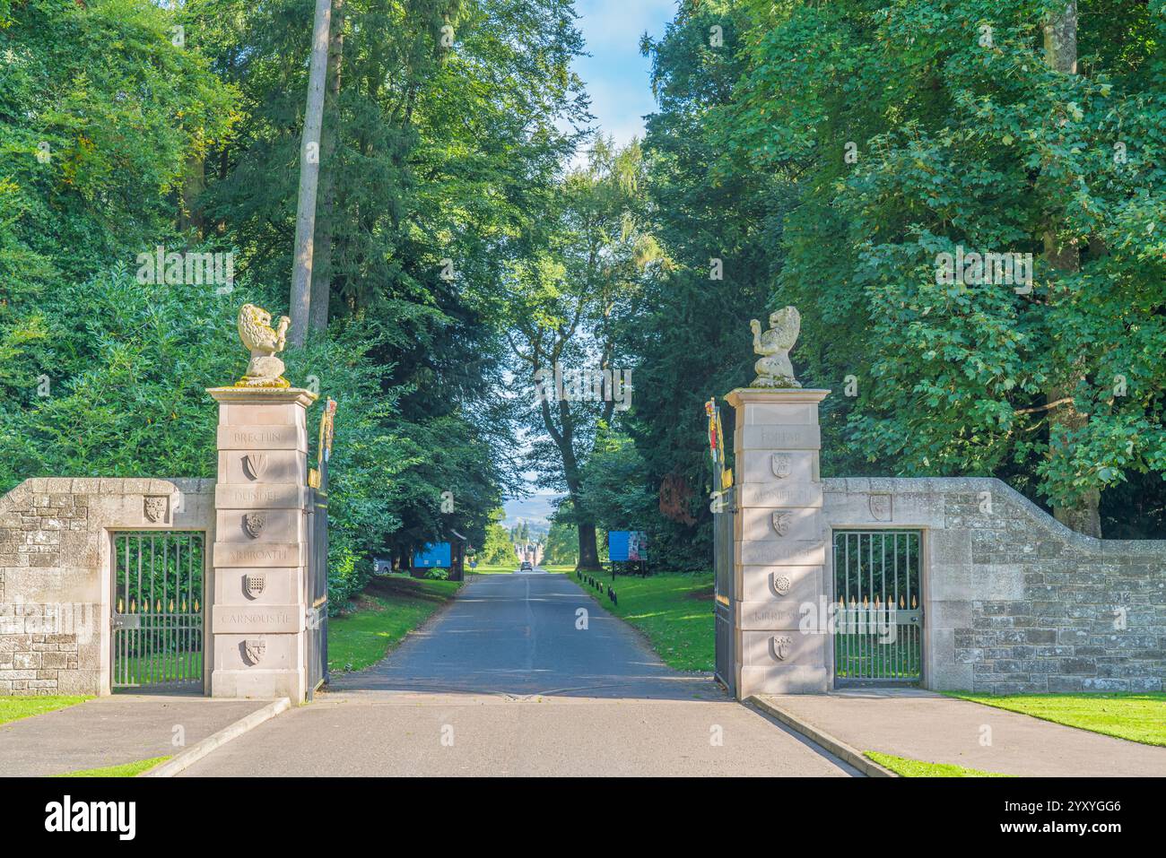 Entrance gate to the historical Glamis Castle in Scotland with green ...