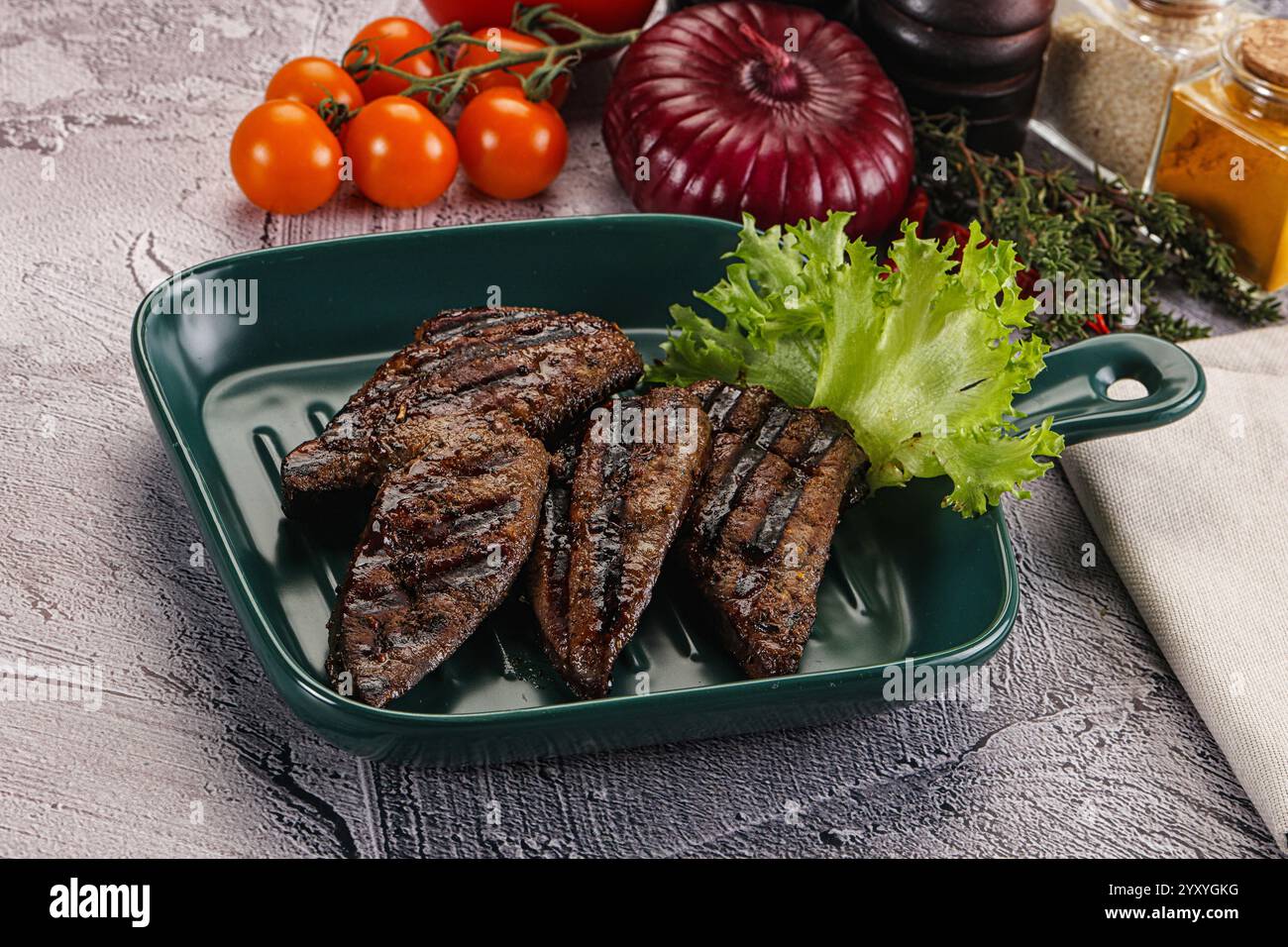 Grilled diet beef liver steak in the plate Stock Photo - Alamy