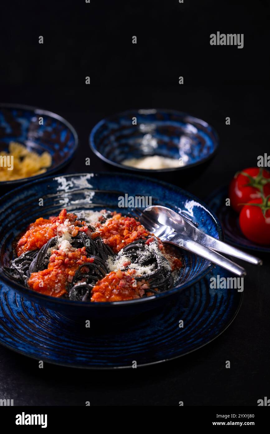 Italian still life with pasta and tomatoes Stock Photo - Alamy