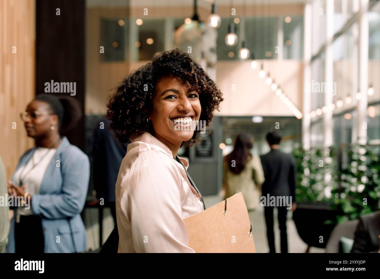 Side view portrait of happy female entrepreneur during seminar at ...