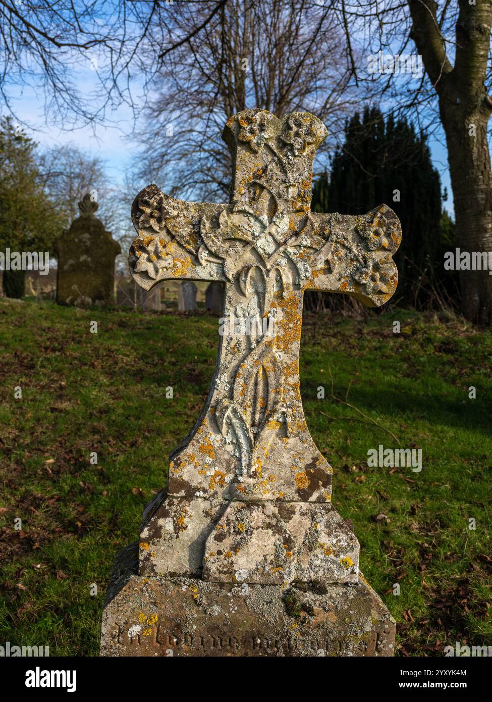 Ornate weathered stone cross in the churchyard of St Andrew, Yardley ...