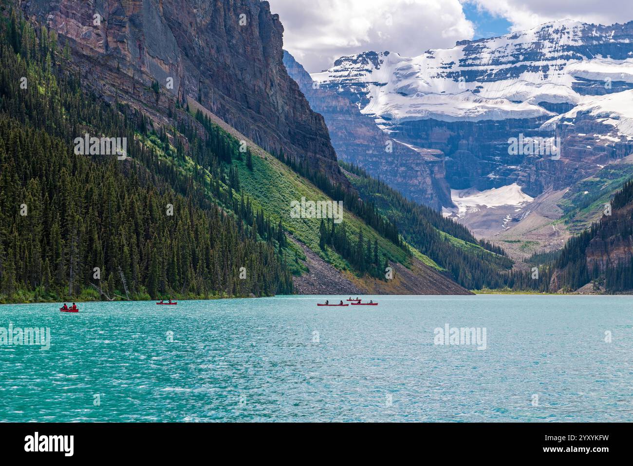 Lake Louise with people in kayak and Victoria Glacier, Banff national ...