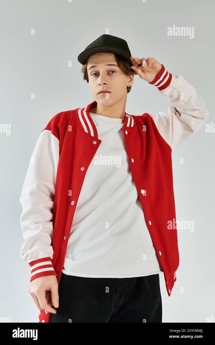 A stylish young student models his bomber jacket in a modern studio ...