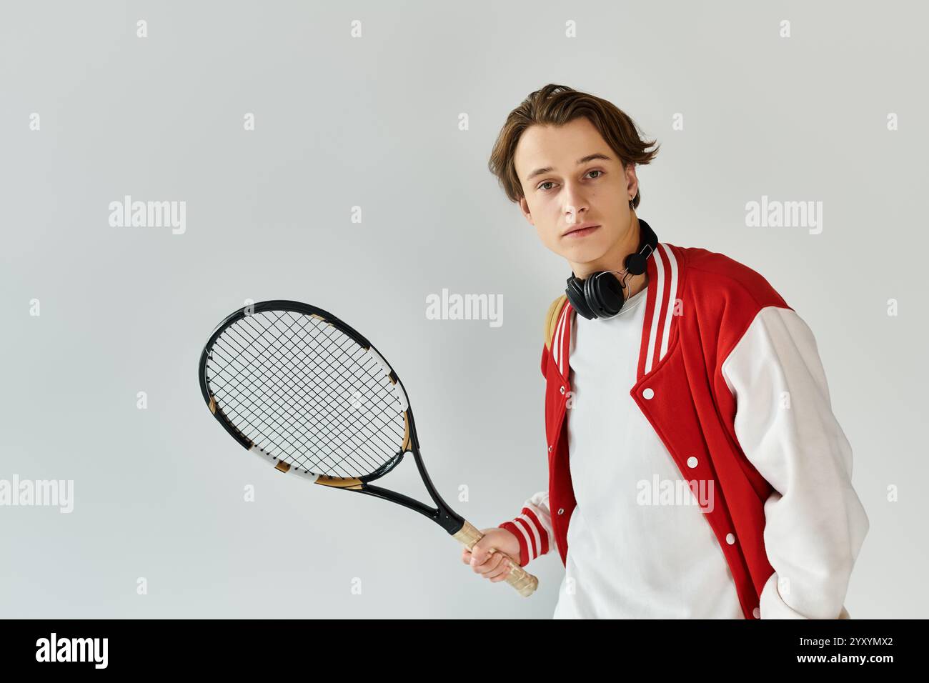 A stylish young man in a bomber jacket showcases his sporty vibe with a ...