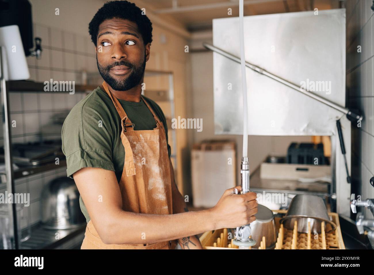 African person cleaning kitchen utensils hi-res stock photography and ...
