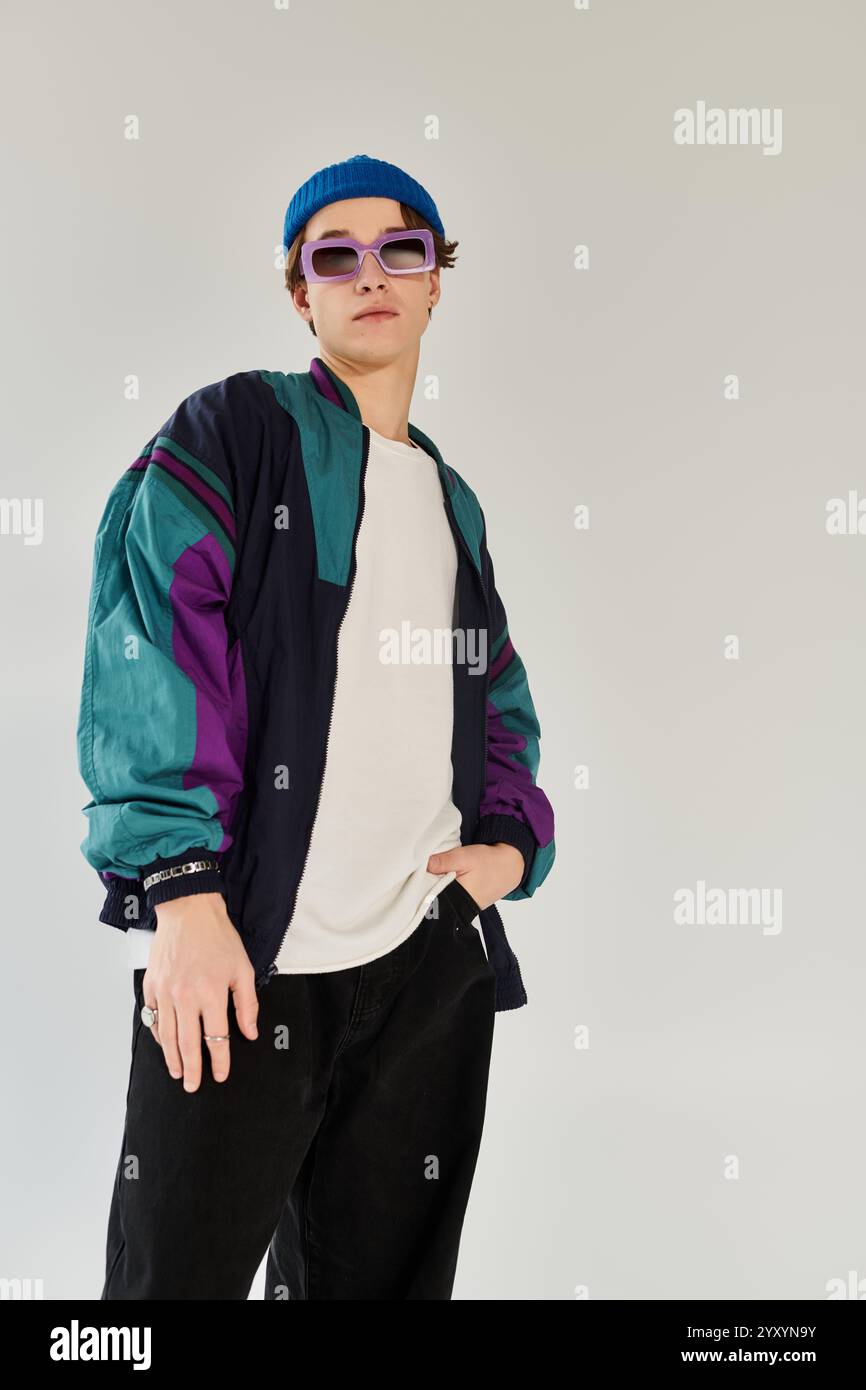 Confident young man showcases fashion in a studio setting during ...