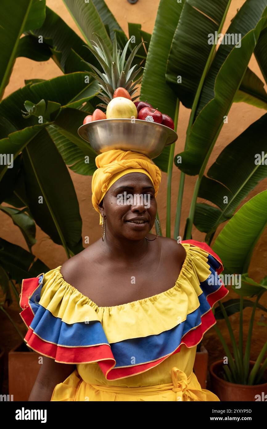 A Palenquera Woman Wearing A Traditional Dress With A Fruit Basket On ...