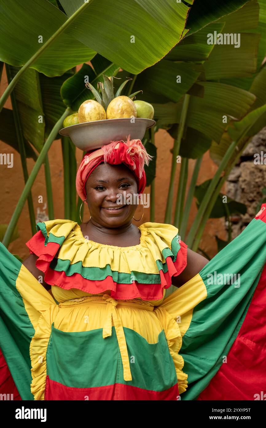 A Palenquera Woman Wearing A Traditional Dress With A Fruit Basket On ...