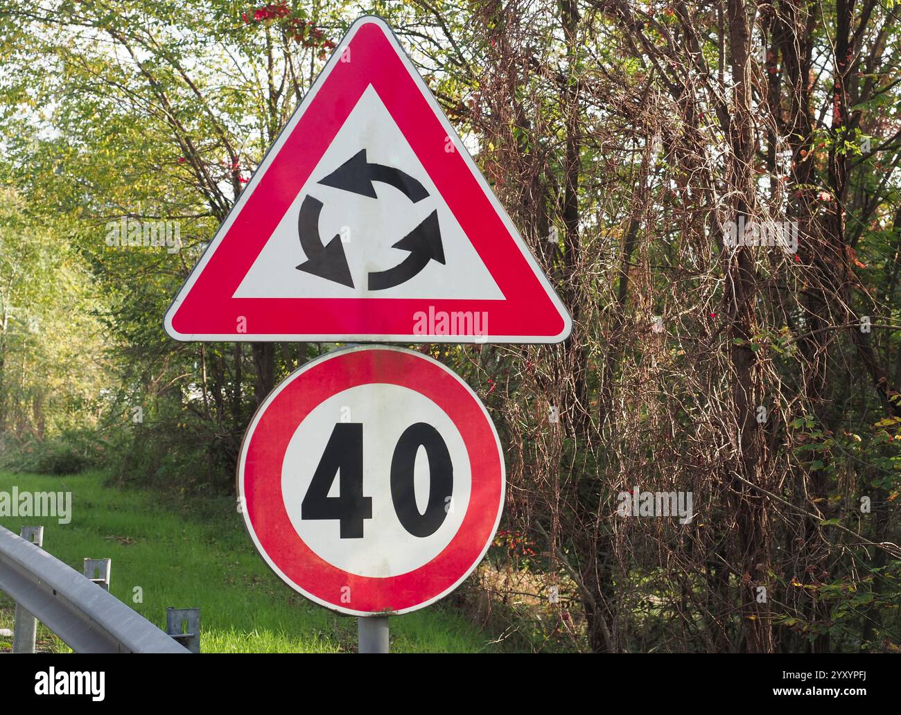 Warning signs, roundabout and speed limit traffic sign Stock Photo - Alamy