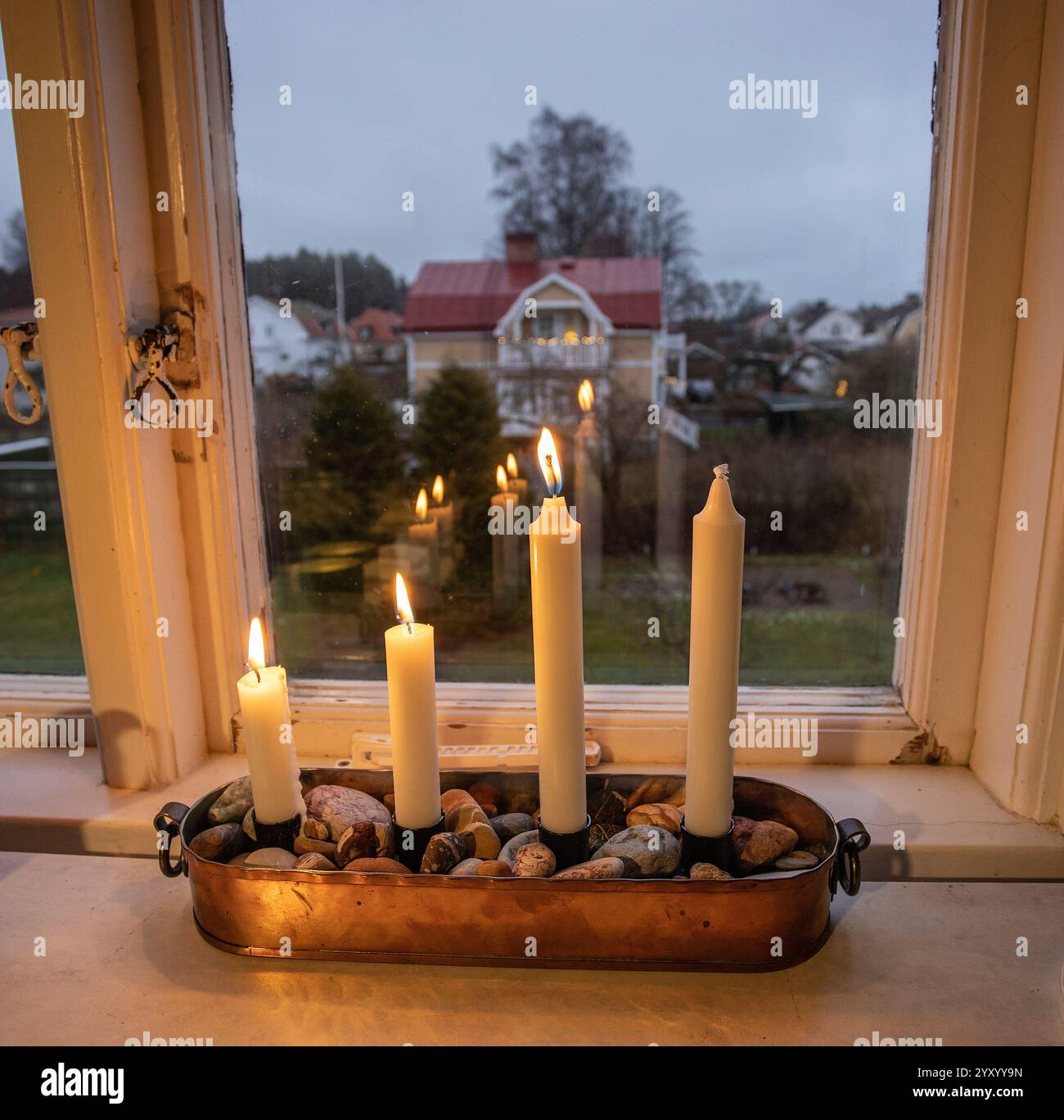 Traditional Advent candlestick with three candles burning on the third ...
