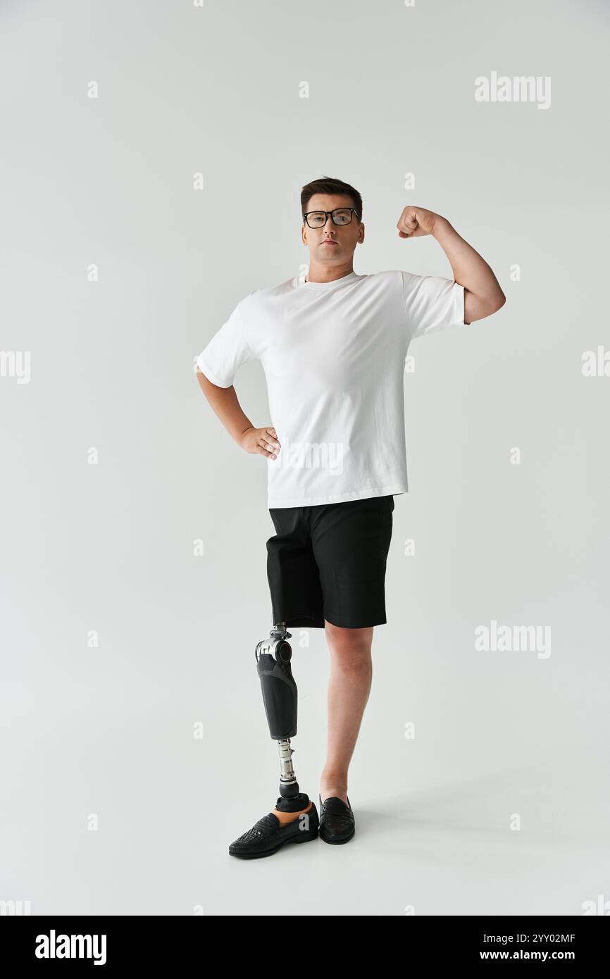 Handsome young man poses with a confident stance, highlighting his ...