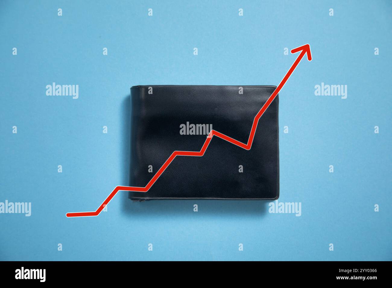 Wallet with a red arrow on the blue background Stock Photo - Alamy
