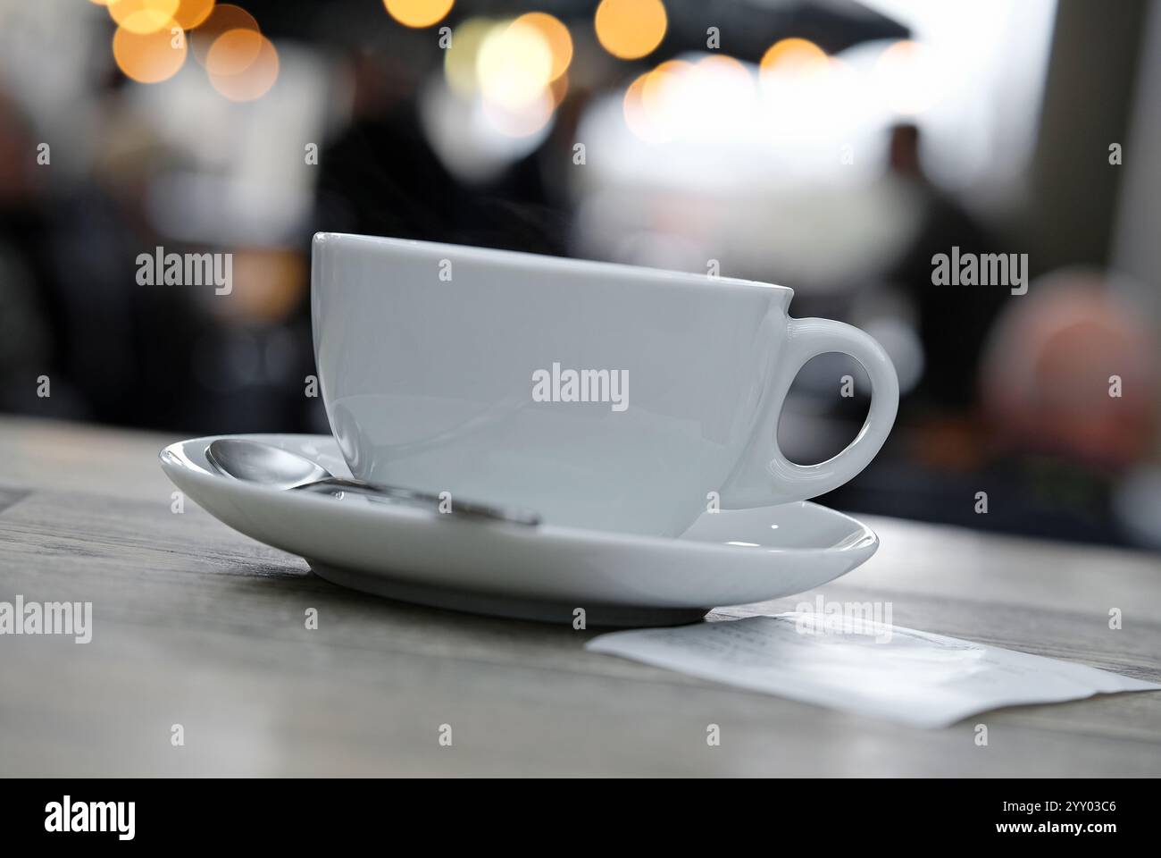 cup of coffee and purchase receipt in cafe setting, norfolk, england ...