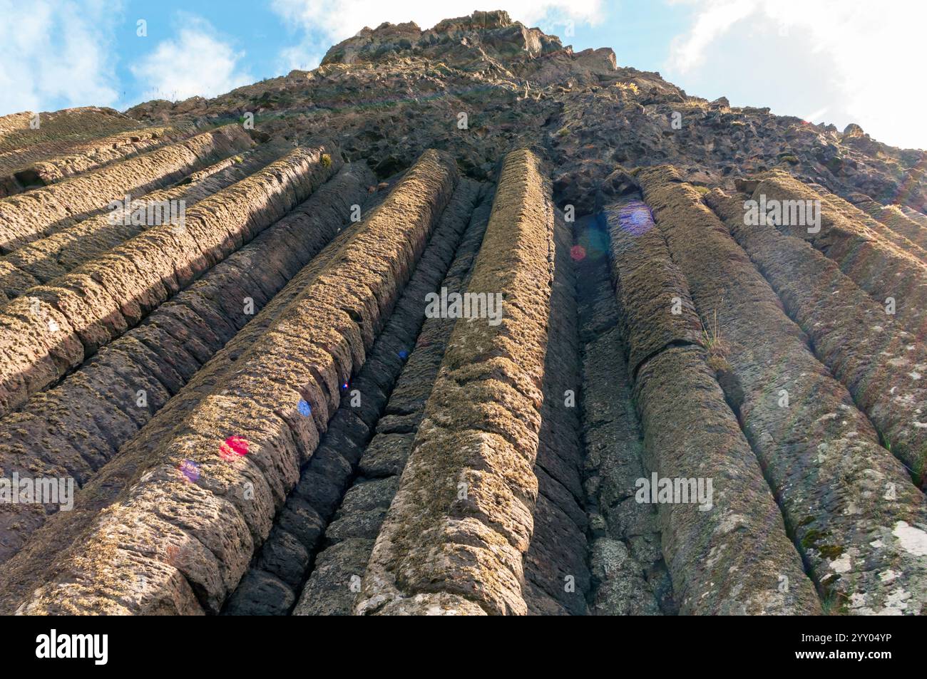 A large rock formation with many ridges and grooves. The rock is ...
