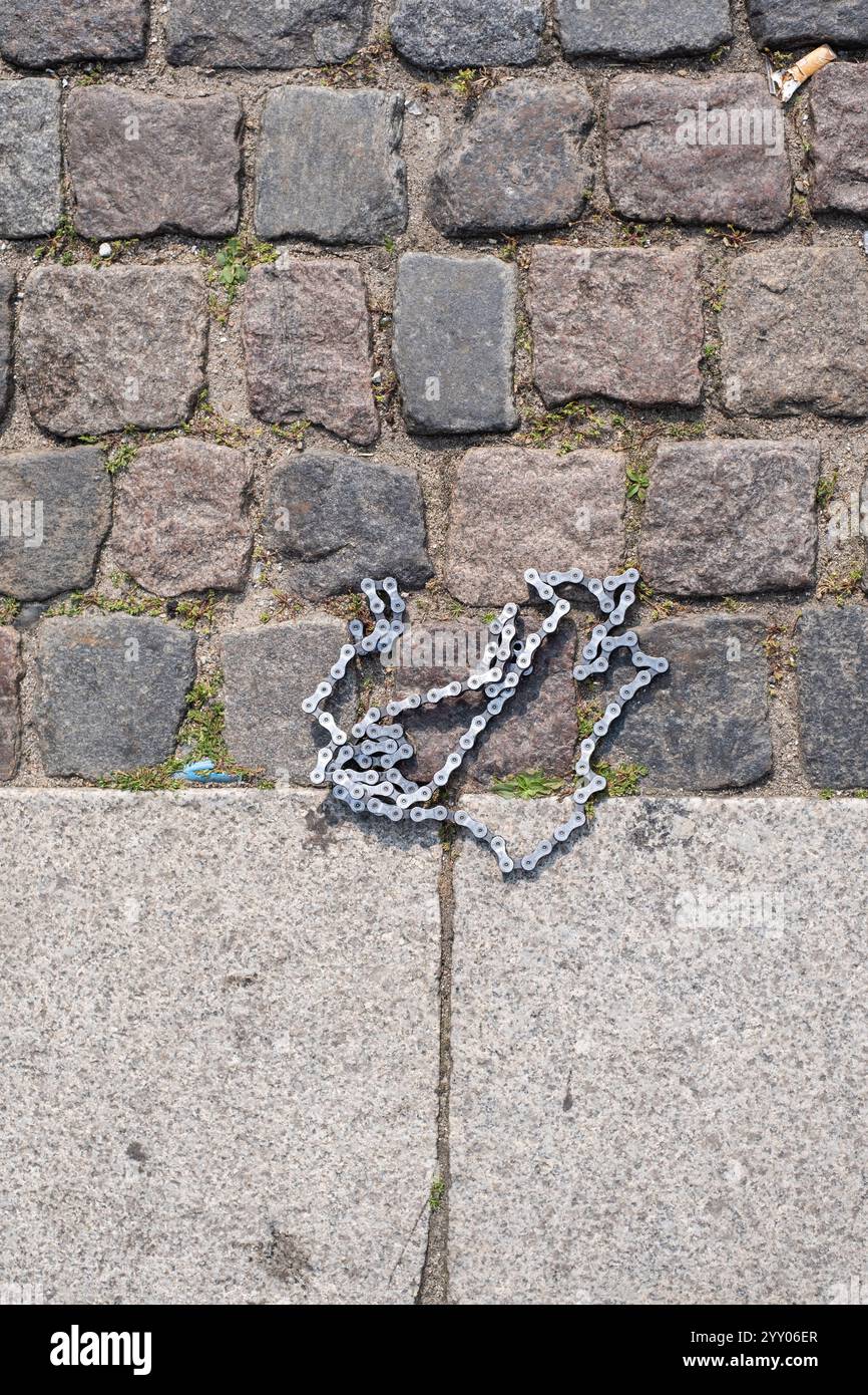 Broken bike chain on the floor. Copenhagen, Denmark, August 2024 ...