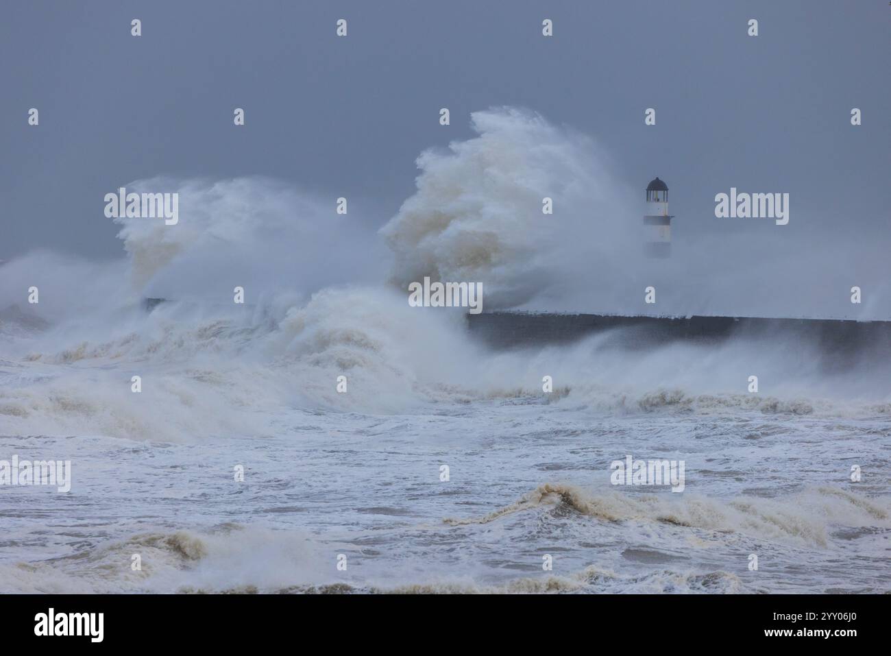 Waves crashing over the lighthouse at Seaham, County Durham, England UK ...