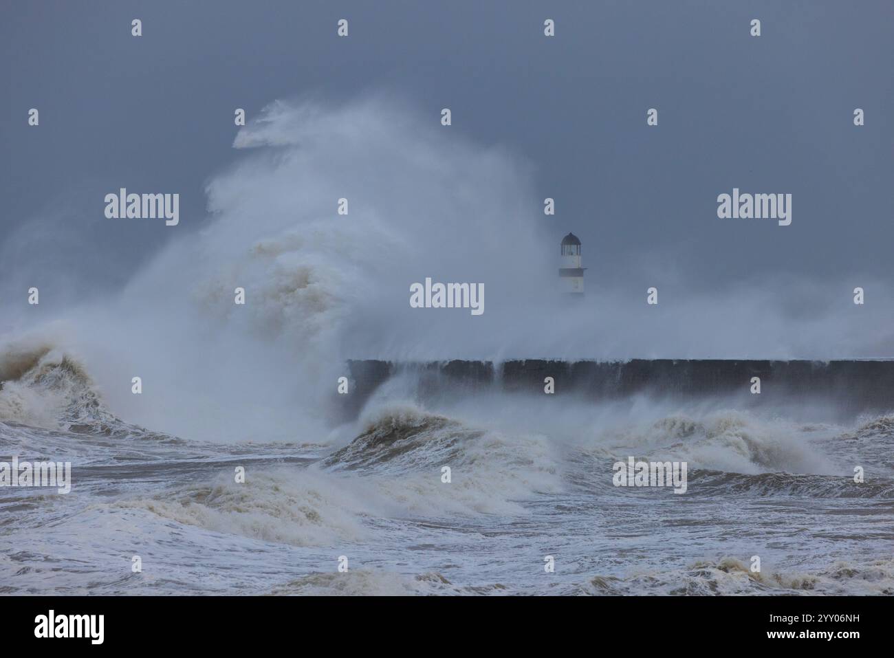 Waves crashing over the lighthouse at Seaham, County Durham, England UK ...