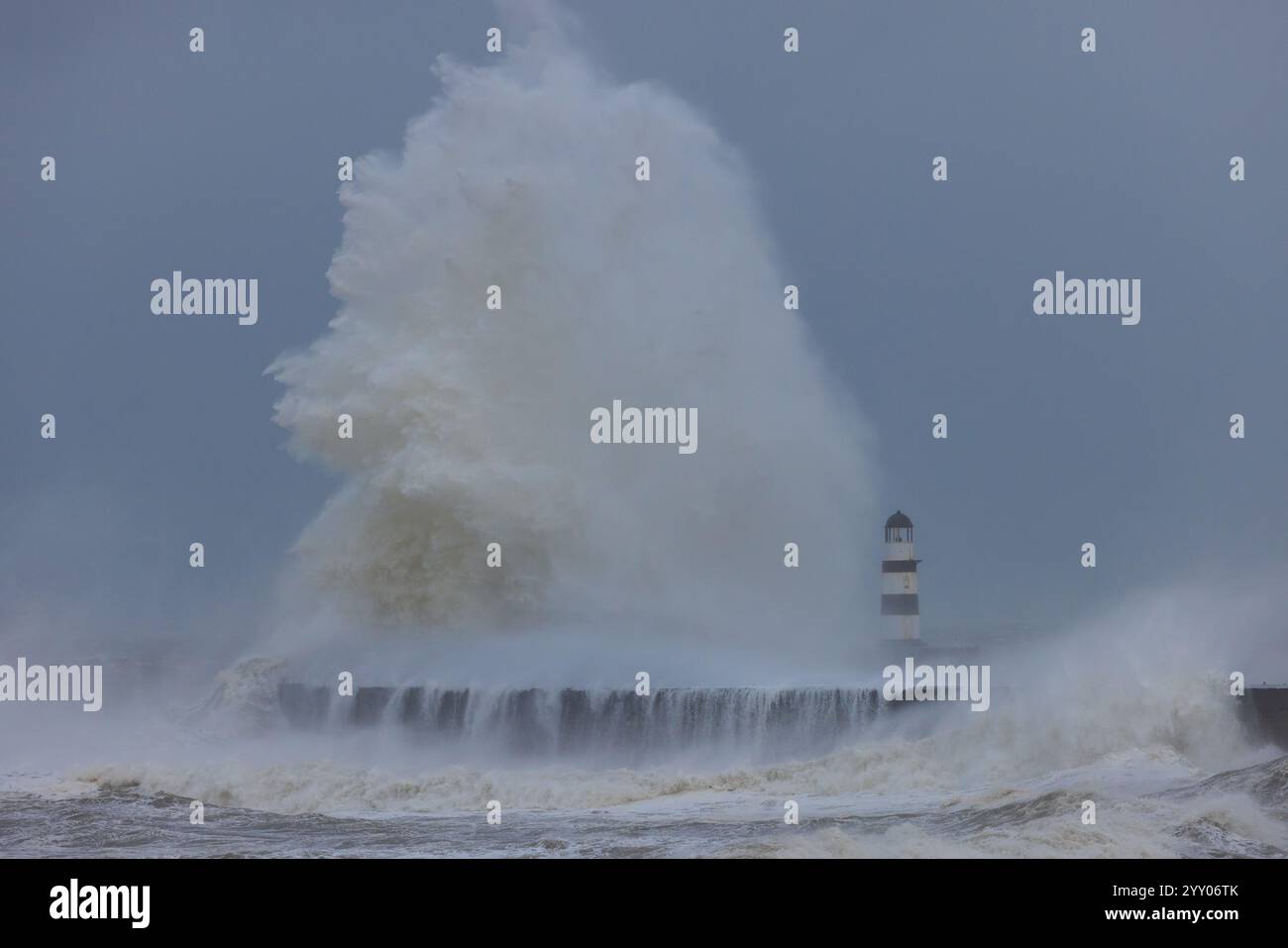 Waves crashing over the lighthouse at Seaham, County Durham, England UK ...