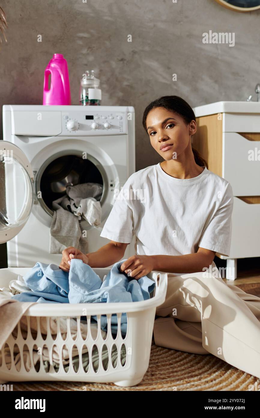 Household chores take the spotlight as a young woman sorts laundry in ...