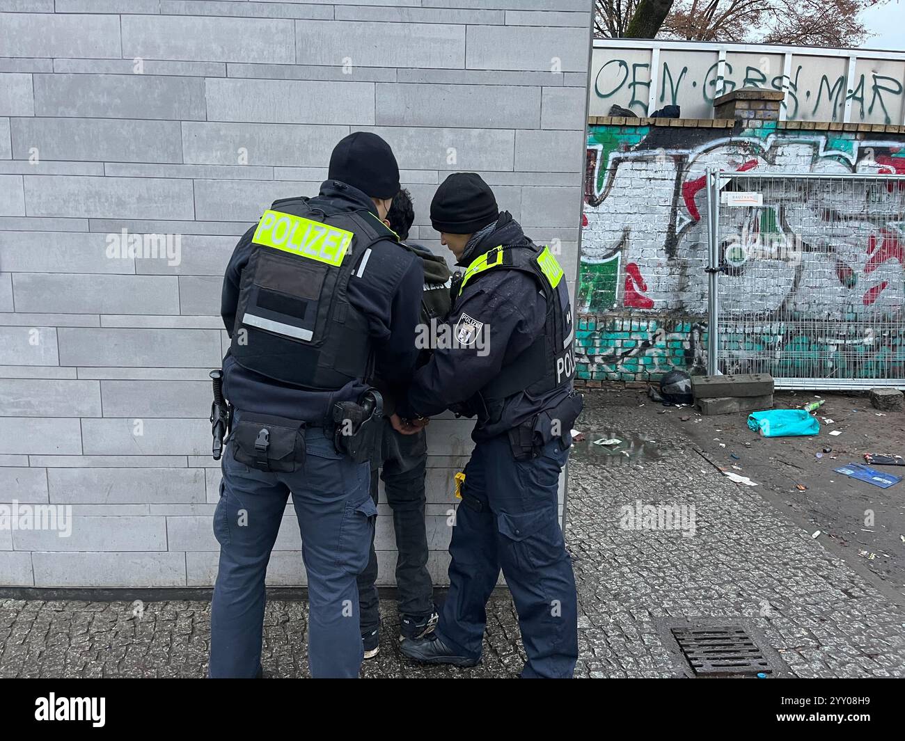 15 December 2024, Berlin: Two police officers are on duty in front of ...