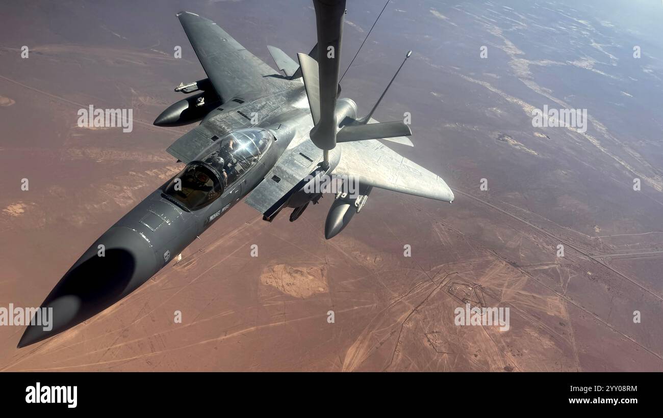 A U.S. Air Force F-15E Strike Eagle receives fuel from a KC-135 ...