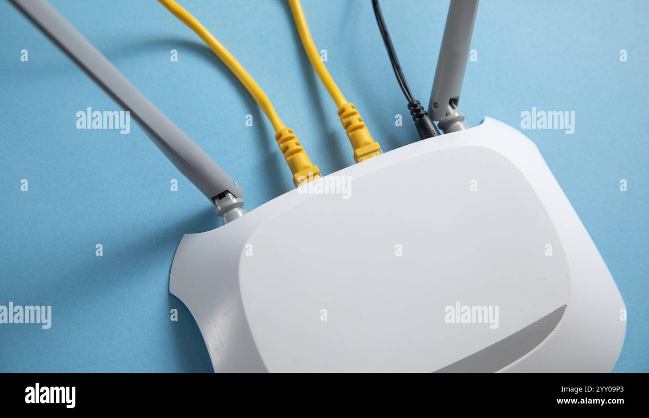 Wi fi router on the blue background Stock Photo - Alamy
