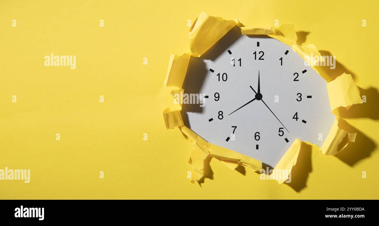Clock on torn paper. Time Management Stock Photo - Alamy